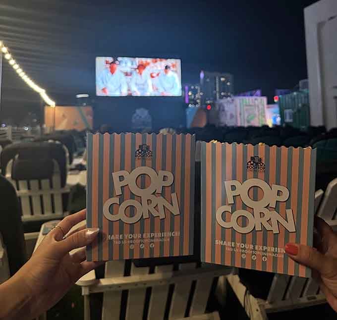 Fresh popcorn in striped boxes because some traditions are too perfect to mess with or modernize.