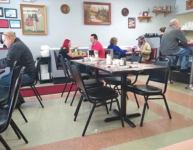 Pink tables and burgundy booths create a retro vibe that somehow makes the food taste even better.
