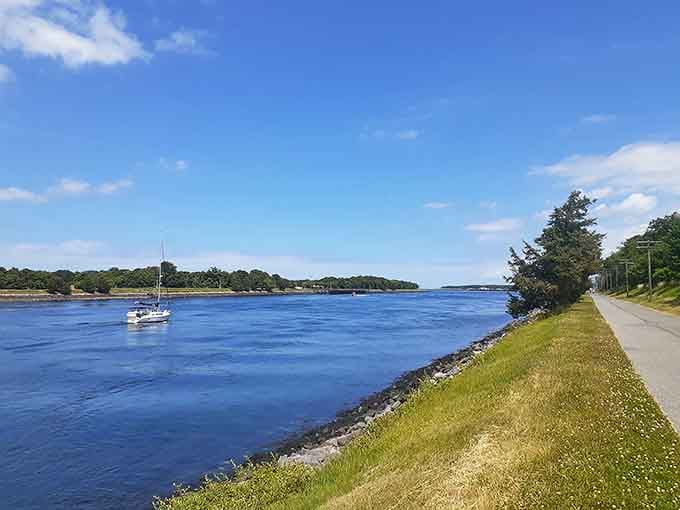 The Cape Cod Canal stretches blue and inviting, perfect for boating, fishing, or just watching massive ships glide impossibly close.