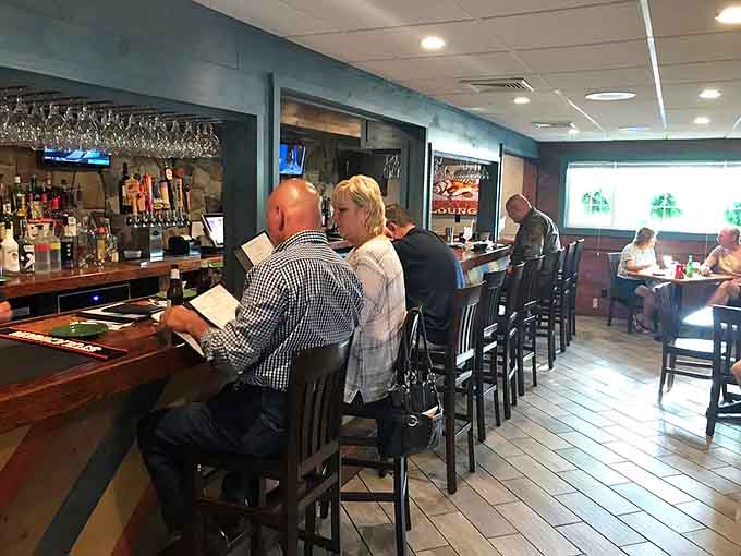 Happy diners at the bar prove that good food creates good times, no matter the day.