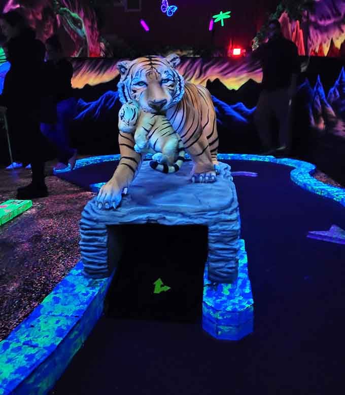 This tiger guards its hole with glowing intensity, daring you to sink that putt under its watchful fluorescent gaze.