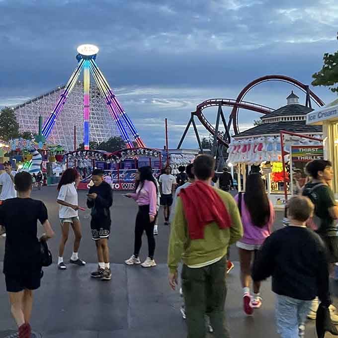 Evening at the park transforms Sky Striker into a glowing beacon, calling thrill-seekers like moths to a very intense flame.