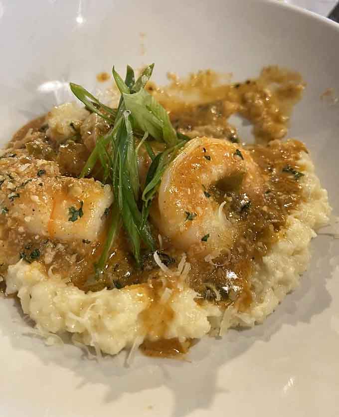 Shrimp and grits so creamy and buttery they'll make you question why you ever ordered anything else in your life.