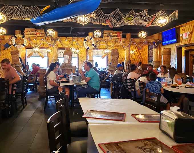 Happy diners dig into their seafood spreads, proving that the best meals require bibs, napkins, and zero pretension.