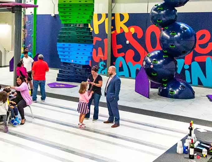 Families gather in the main area, plotting their next adventure like generals planning a joyful campaign.