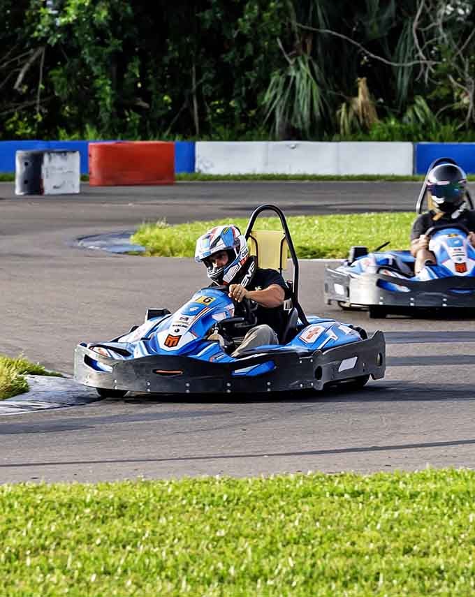 Leaning into the curve with determination, this racer shows the concentration required to shave precious seconds off lap times.