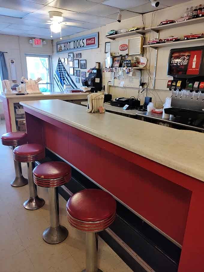 Chrome stools and a clean counter invite you to sit, stay awhile, and remember simpler times fondly.
