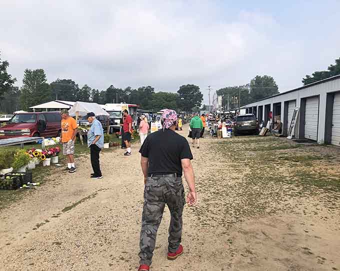 The universal flea market stance: hands on hips, surveying the landscape, calculating how much fits in the car.