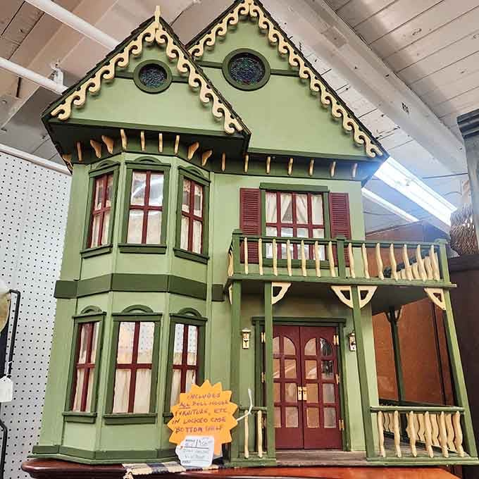 This elaborate dollhouse is fancier than most actual houses and probably has better curb appeal than your neighbor's place.
