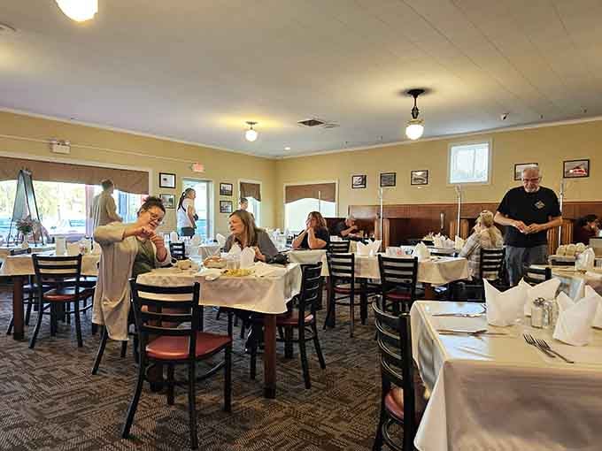 Real people enjoying real meals in a real restaurant, not a corporate chain pretending to have character.