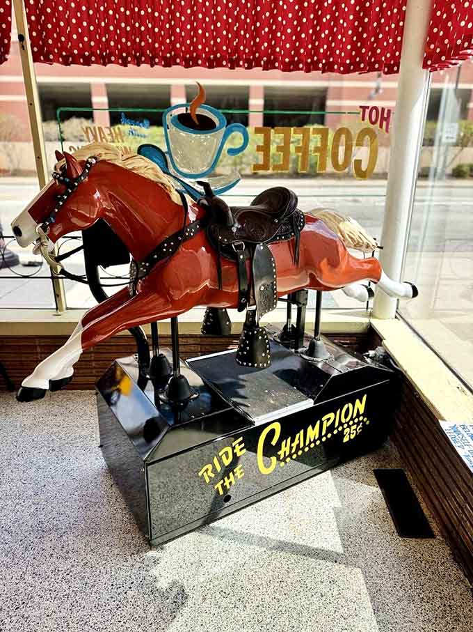 A vintage mechanical horse waits patiently by the window, ready to entertain the next young cowboy or cowgirl who claims it.