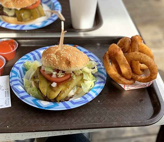 That burger's leaning tower of deliciousness paired with rings that deserve their own standing ovation tonight.