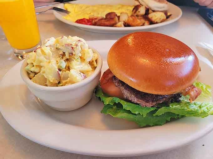 Juicy burger on brioche with creamy potato salad: lunchtime never looked this tempting or delicious.