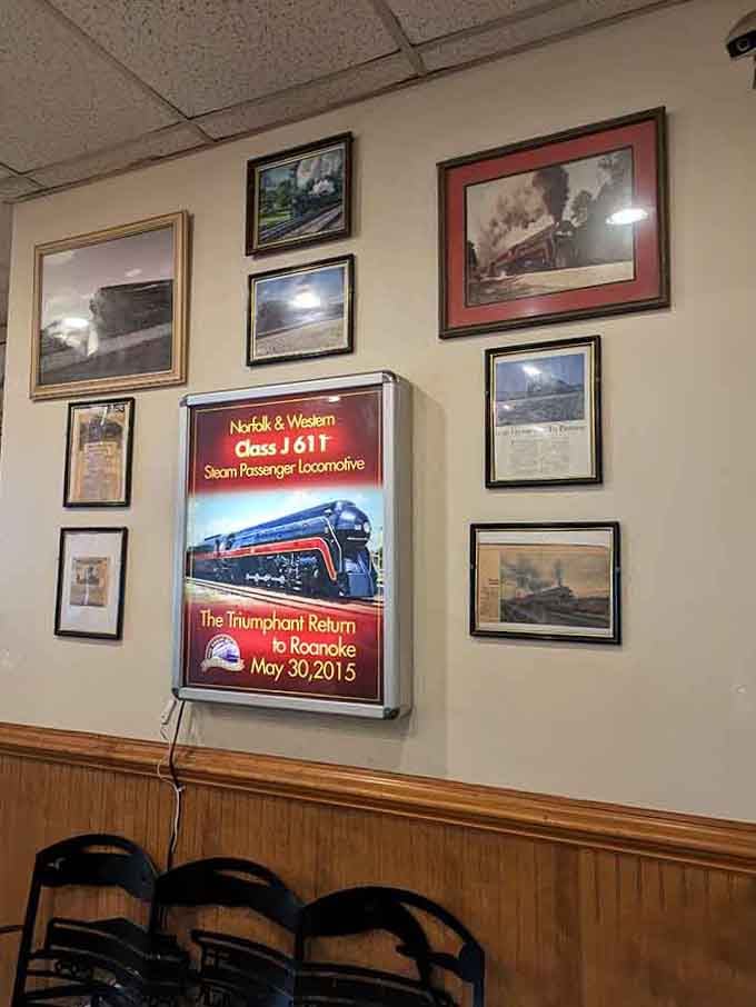 Vintage locomotive posters and framed photographs celebrate the Class J 611's triumphant return, honoring Roanoke's proud railroad heritage beautifully.