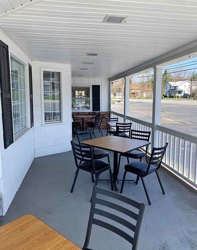 Covered porch seating lets you enjoy your meal outdoors without worrying about unexpected weather interruptions.