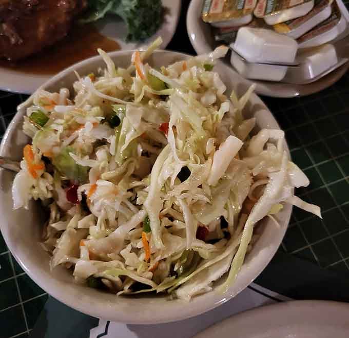 Fresh coleslaw providing the crisp, tangy contrast your taste buds need between bites of all that rich, hearty goodness.