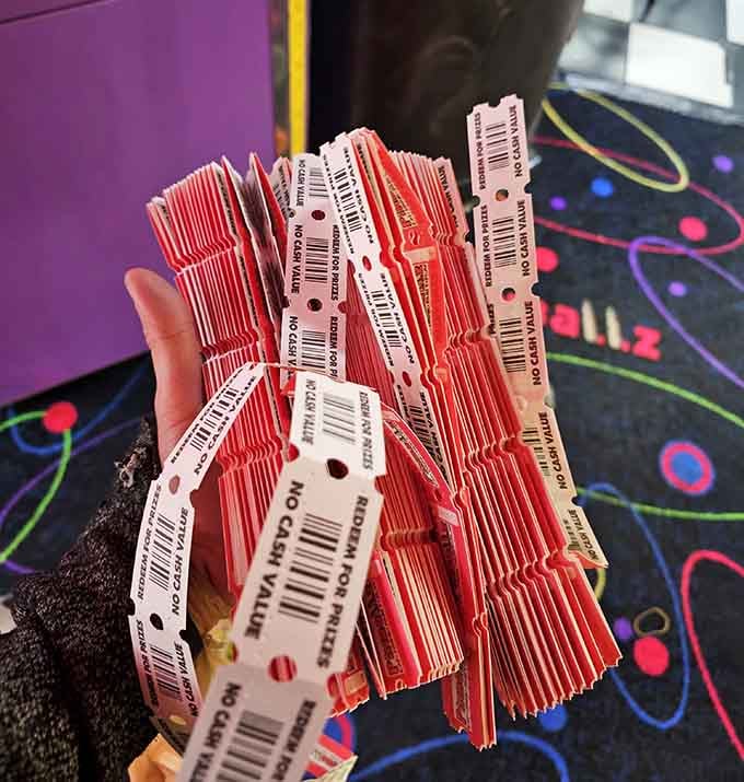 A fistful of arcade tickets representing hours of effort and approximately three dollars worth of prize redemption.