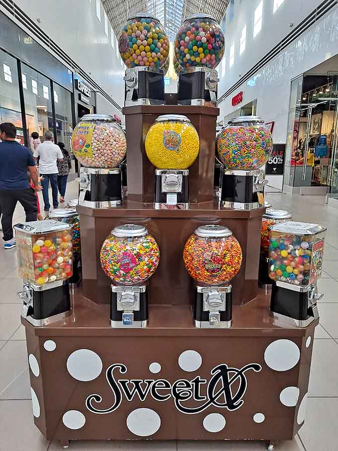 This candy tower is basically childhood nostalgia meets adult purchasing power, and everyone wins.