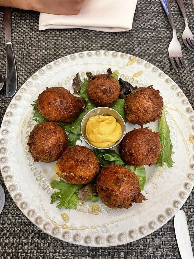 Golden-fried hushpuppies with honey mustard prove that Southern comfort food has a permanent home on this eclectic menu.