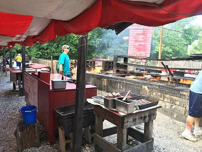 Wood-fired cooking stations where your dinner gets prepared the way humans have been doing it for millennia, just better.