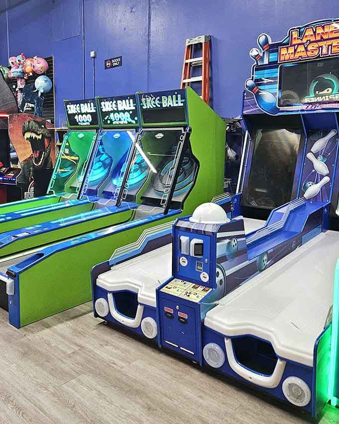 Skee-Ball lanes stand ready for competition, those satisfying rolling sounds echoing through generations of family fun.