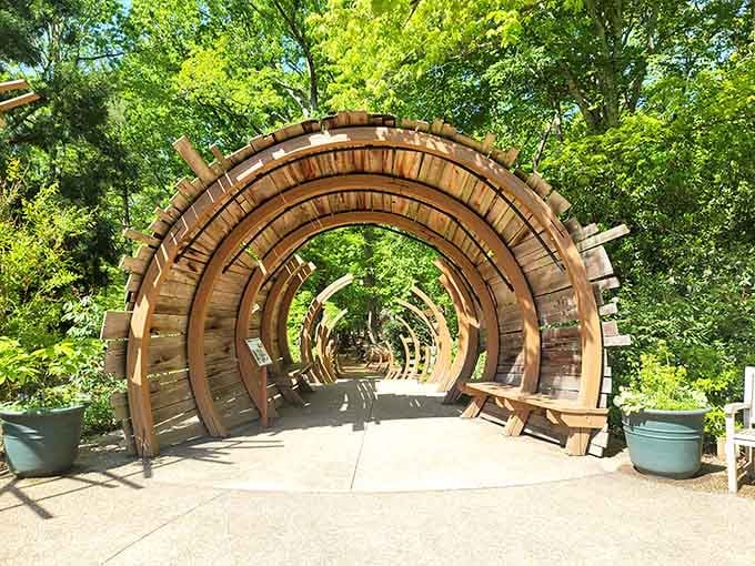 This curved wooden tunnel creates an architectural marvel that makes walking feel like an adventure through organic geometry.