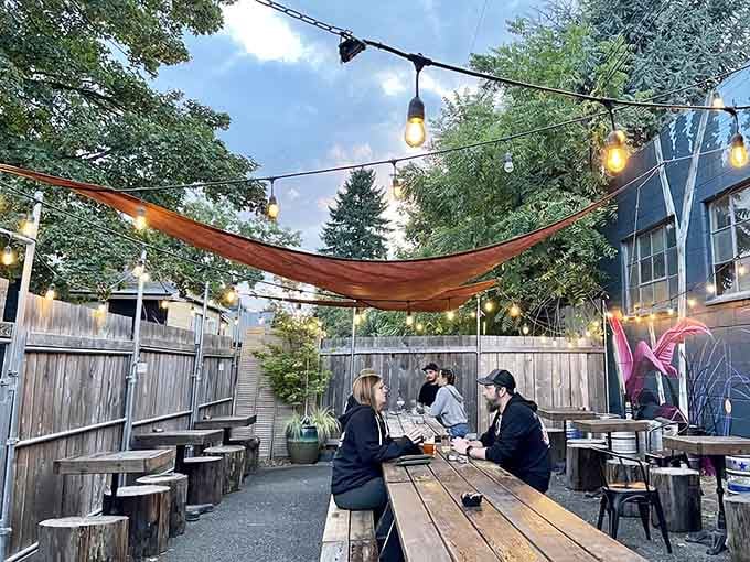 String lights and shade sails transform the back patio into an urban oasis perfect for summer evening dining.