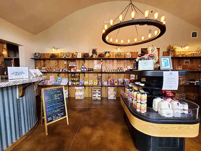 The circular candle chandelier casts warm light over local products and treats begging to go home with you.