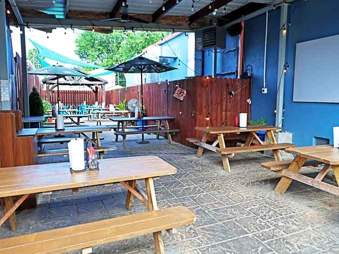 The patio where picnic tables and shade umbrellas create the perfect spot for outdoor burger consumption and people-watching.