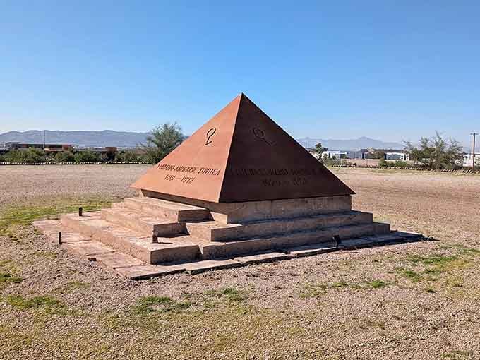 This copper pyramid memorial sits quietly on the grounds, a testament to the property's layered past.