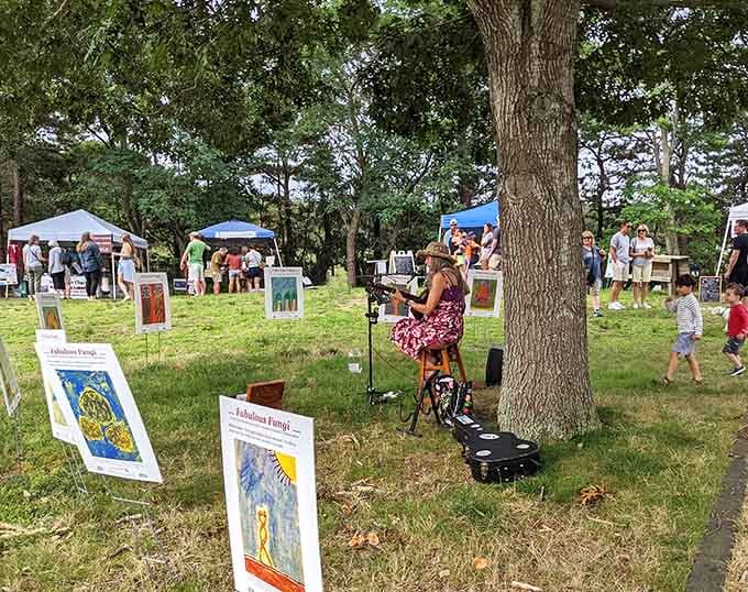 The farmers market buzzes with local energy, art, and fresh finds under the shade of ancient trees.