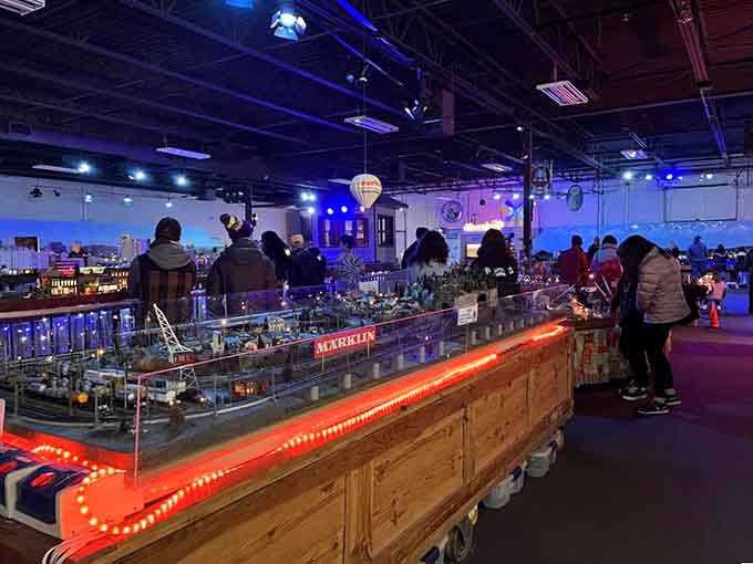 Visitors of all ages lean in close during special evening events when the layouts truly come alive.