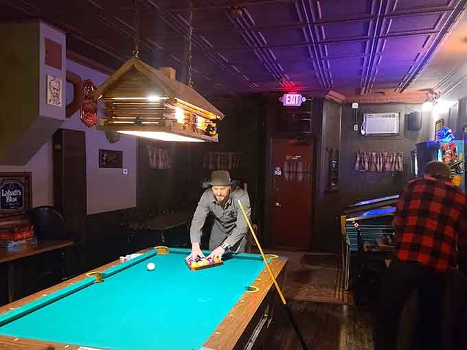 That pool table has witnessed more friendly competitions than a Little League season times infinity.