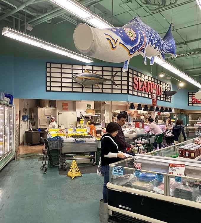That giant fish sculpture knows what's up&mdash;the seafood counter below is where the magic really happens.
