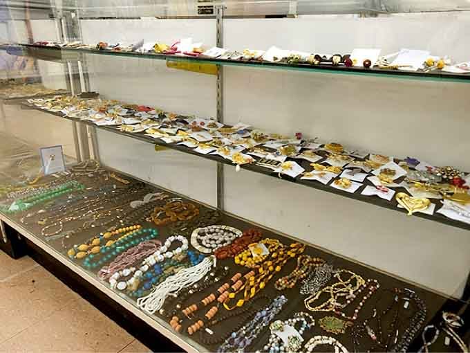 Sparkly treasures glitter under fluorescent lights, waiting to add some pizzazz to someone's jewelry box tonight.