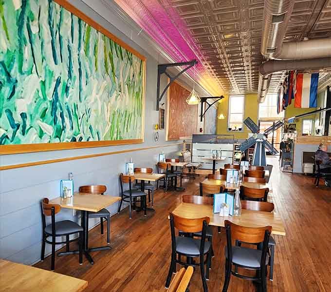 Colorful murals and international flags transform this dining room into a cheerful European escape in Missouri.