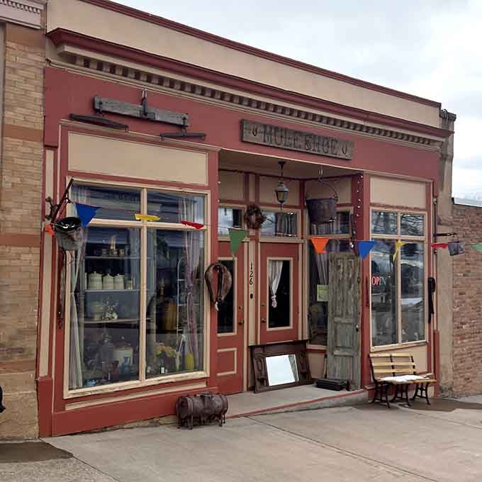 The Muleshoe storefront displays eclectic treasures behind windows that have seen generations pass by daily.