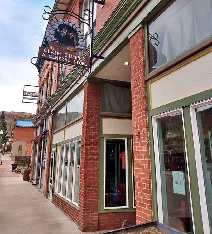 The Claim Jumper's hanging sign and historic building remind visitors that commerce here has always required creativity and determination.