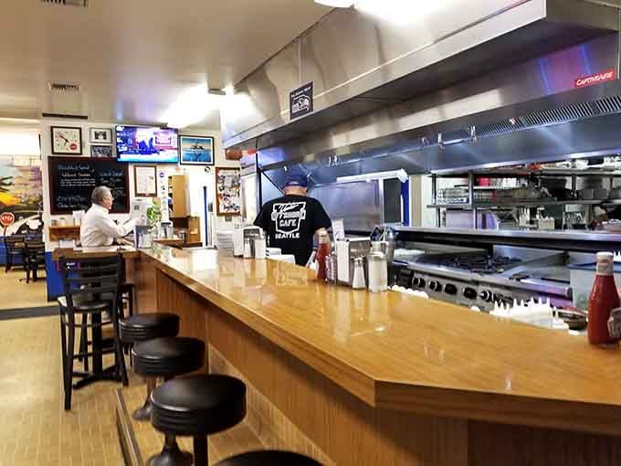 Counter seating offers front-row views of the kitchen choreography that makes breakfast magic happen daily.