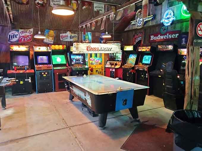 Vintage arcade games and neon beer signs in the game room prove that fun is a universal language.