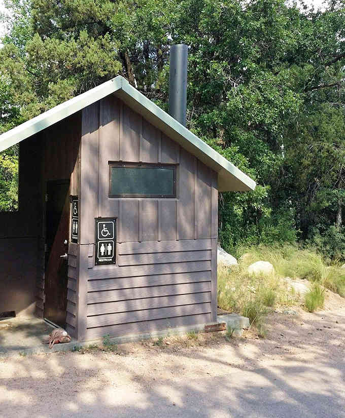 Modern facilities meet wilderness here, proving you can answer nature's call without roughing it too much.