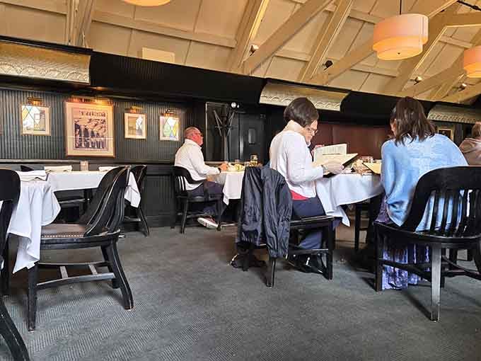 Diners enjoying their meals in comfortable booths, because great food tastes even better in good company always.