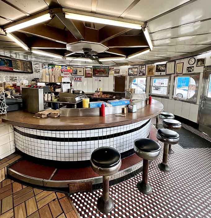 That circular griddle setup means everyone gets a front-row seat to the greatest show in Jersey City.