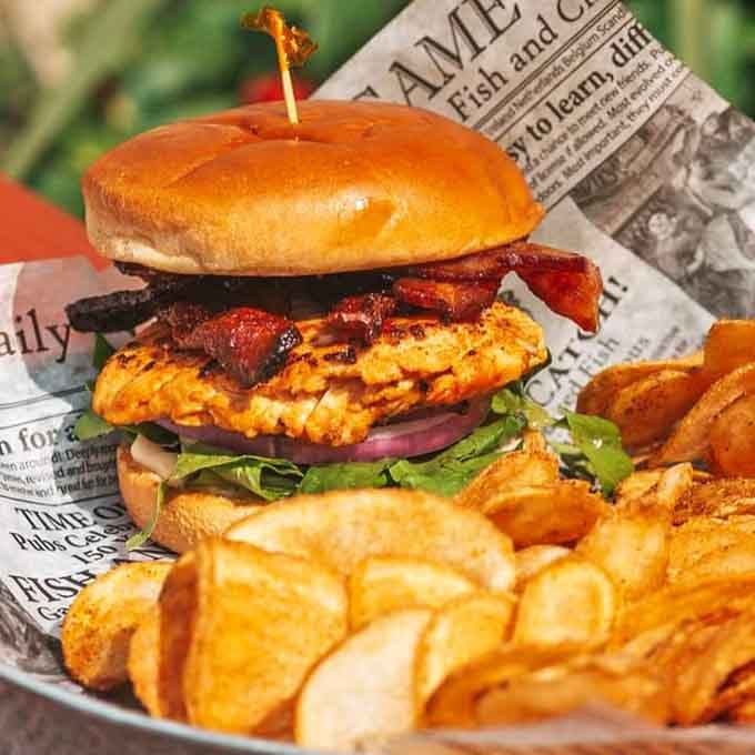 Grilled chicken meets crispy bacon on a toasted bun, proving that some classic combinations never go out of style.
