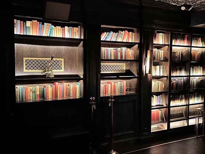 Those backlit bookshelves aren't just for show, they're conversation starters that make waiting for your table almost enjoyable.