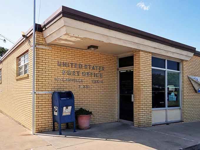 The old post office wears its yellow brick proudly, a reminder when mail came from neighbors you knew.