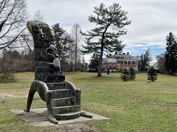 Whimsical bronze figures climb toward the sky while the historic mansion watches over the peaceful estate.