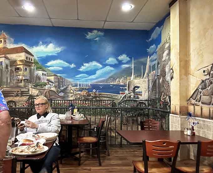 Dining beneath an Italian harbor scene makes every meal feel like a vacation you didn't pack for.