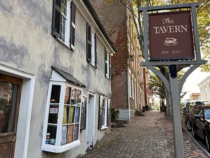 Cobblestone alley and vintage tavern sign transport you straight back to colonial times, minus the powdered wigs.
