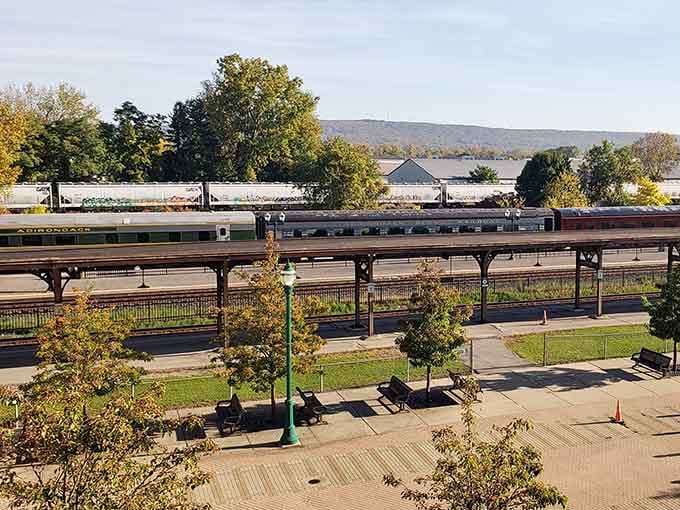 The pristine Adirondack lakes reflect the sky like mirrors as the train glides peacefully past their shores.